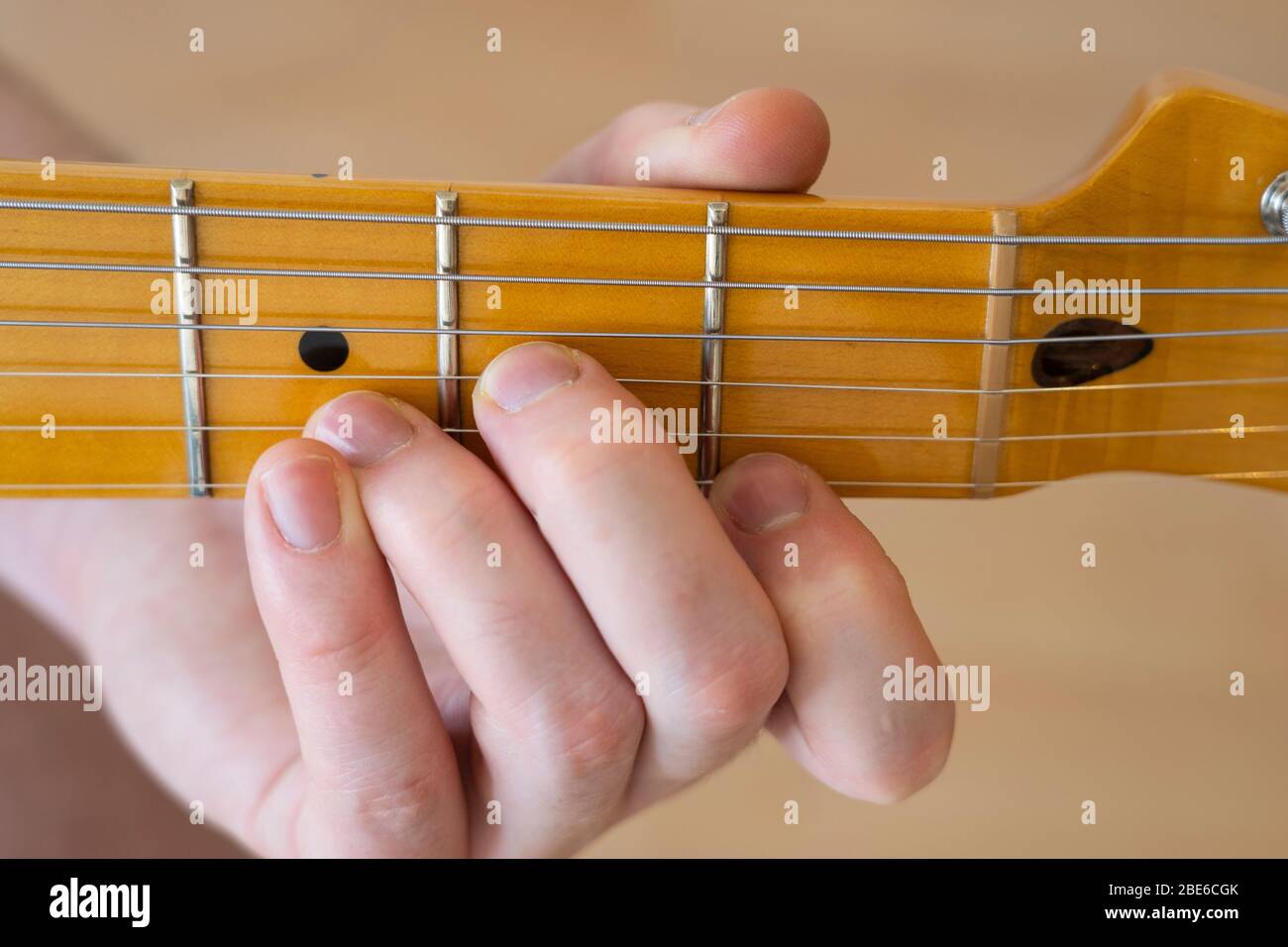Playing / demonstrating a Dm, D minor chord shape on a Fender Modern ...