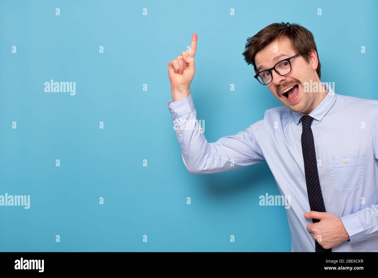 Businessman giving thumbs up pointing hi-res stock photography and ...