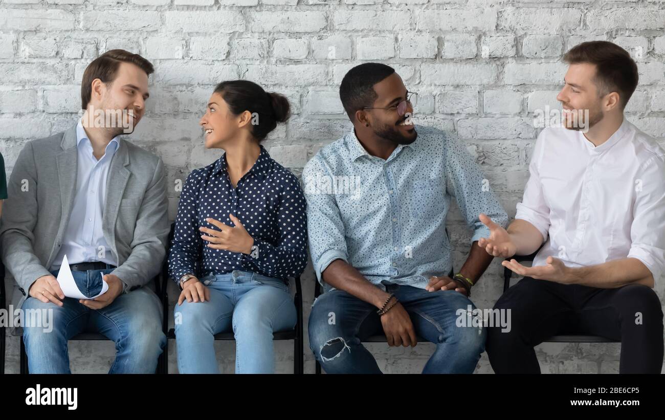 Happy diverse multiethnic candidates talk before interview Stock Photo ...