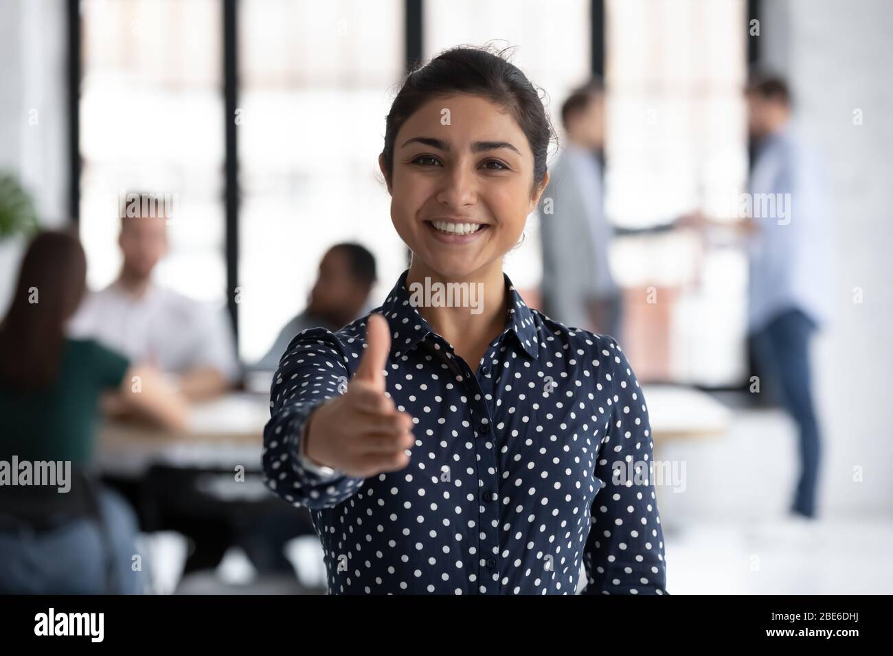 Smiling indian recruiter stretch hand welcoming new employee Stock ...