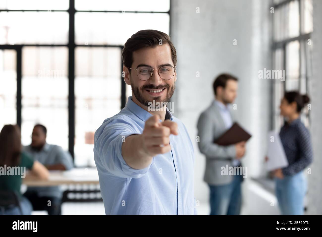 Smiling ceo pointing finger camera hi-res stock photography and images ...