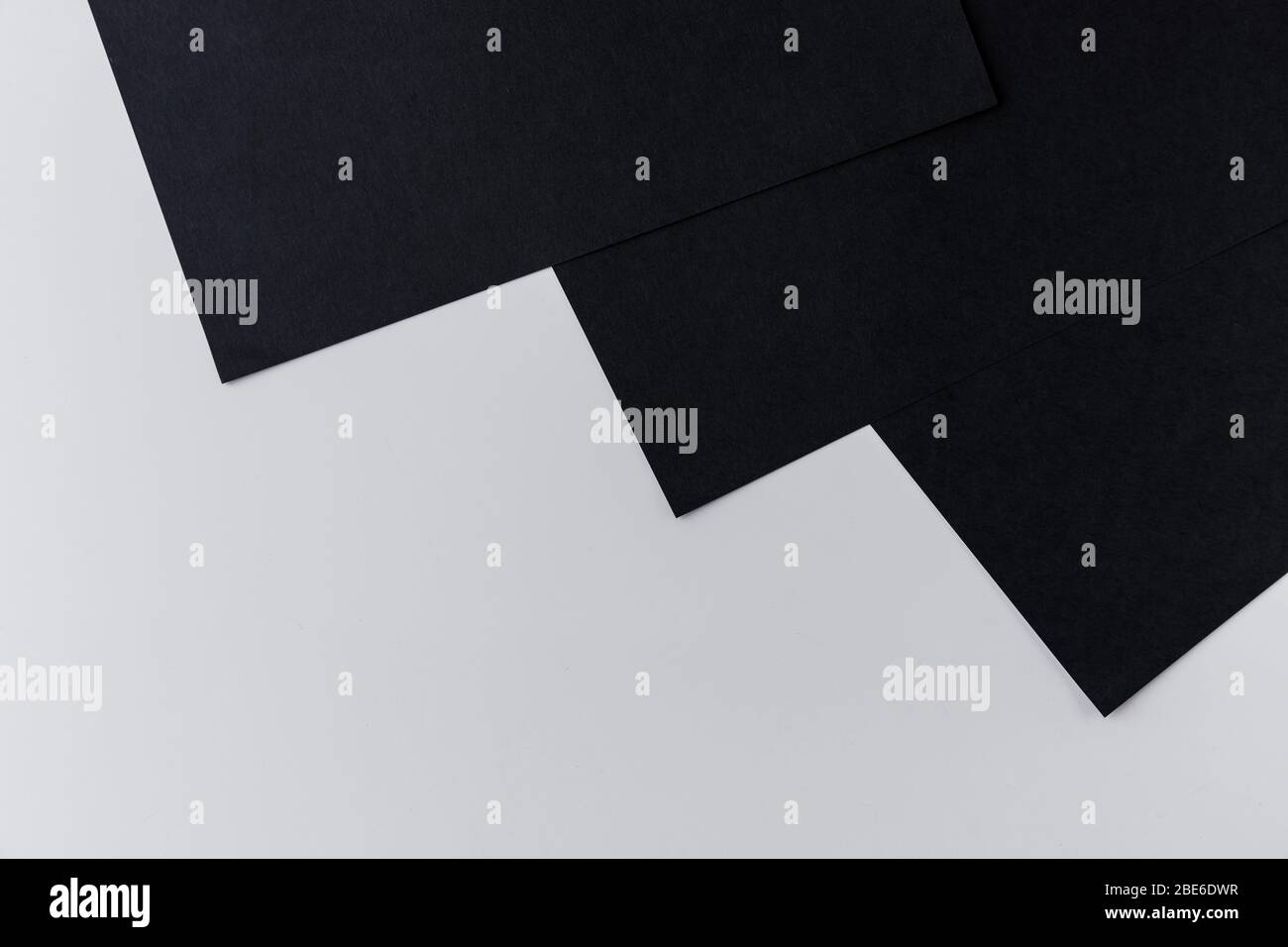 Pattern of black paper laid out in the form of rays one after another ...