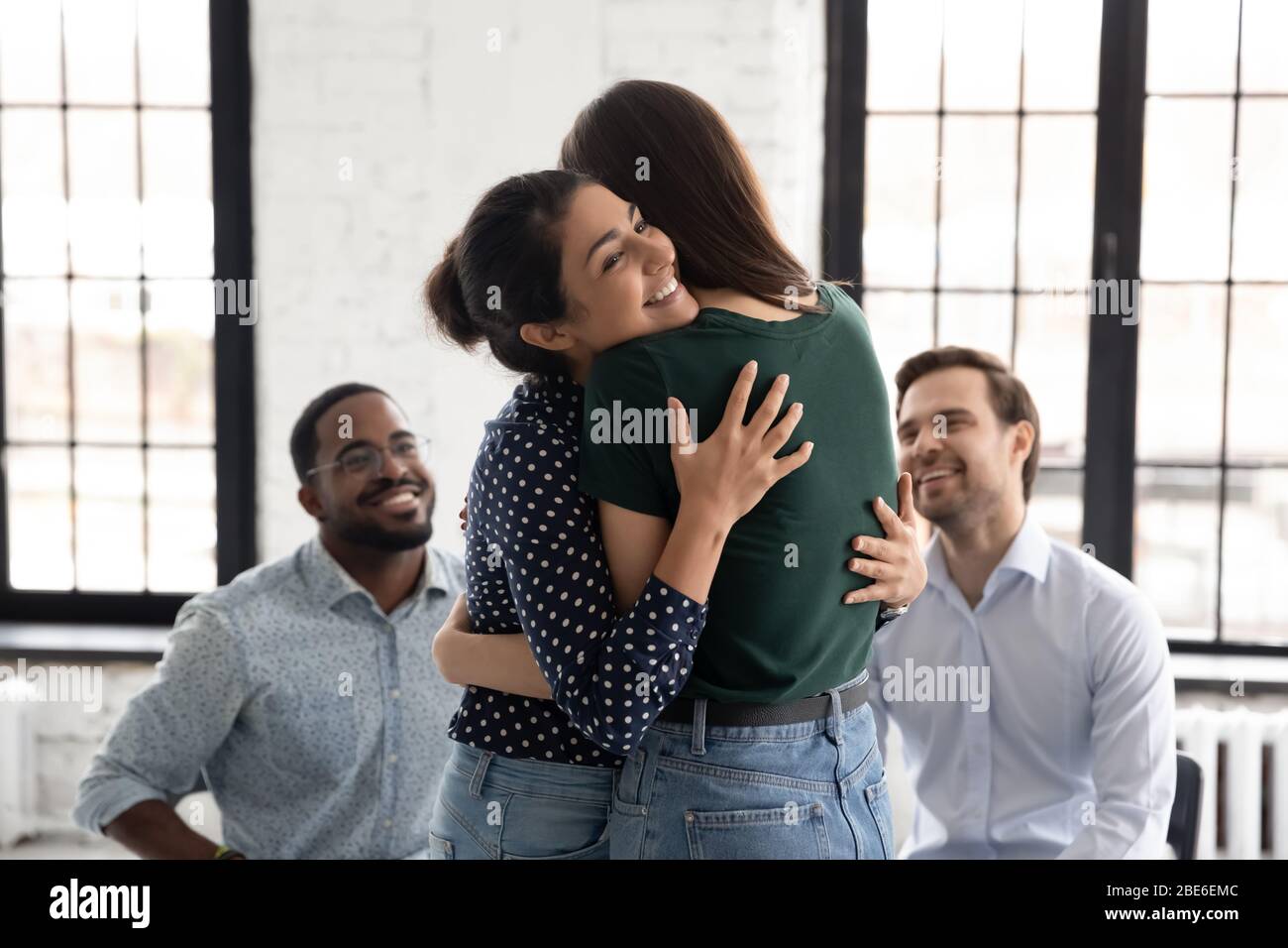 Female patients hug participate in group counseling session Stock Photo ...