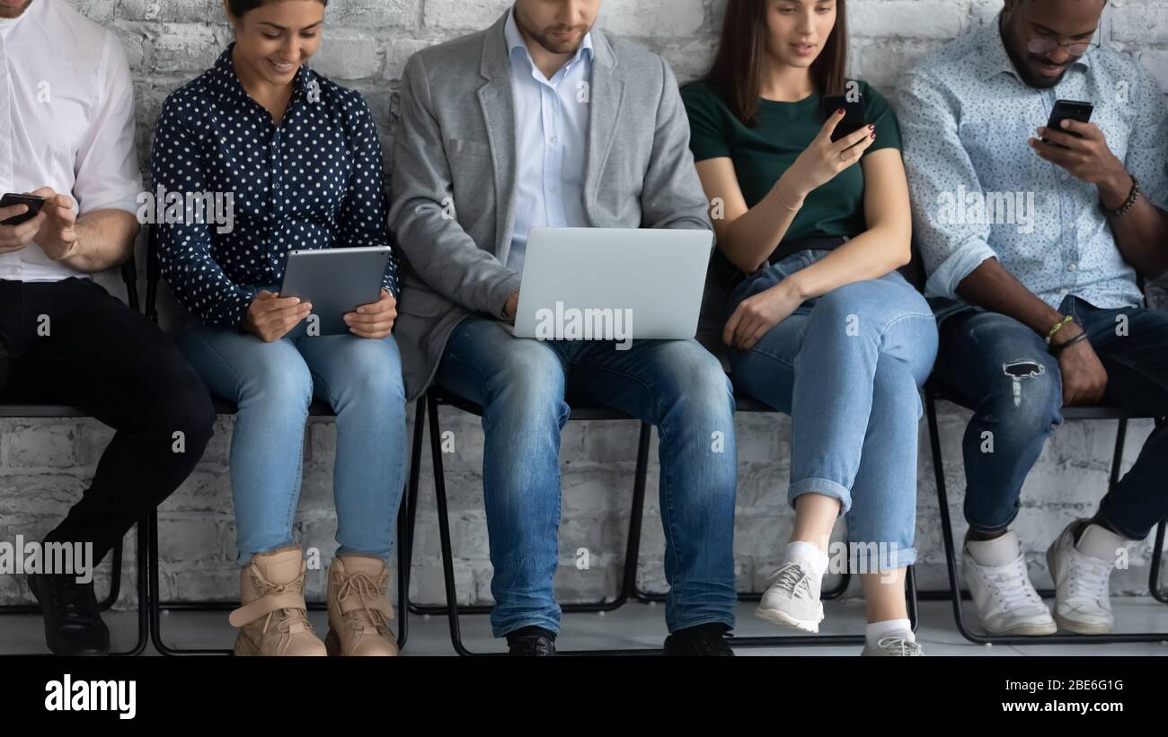 Diverse job applicants using gadgets preparing for interview Stock ...