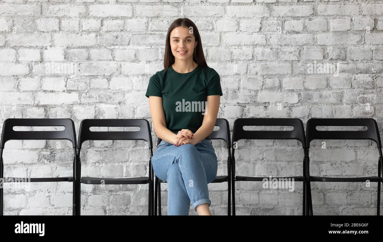 Smiling Caucasian female employee wait for interview in office Stock ...