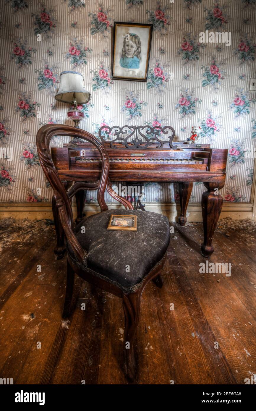 Piano music room in abandoned house with wallpaper and antiques Stock ...