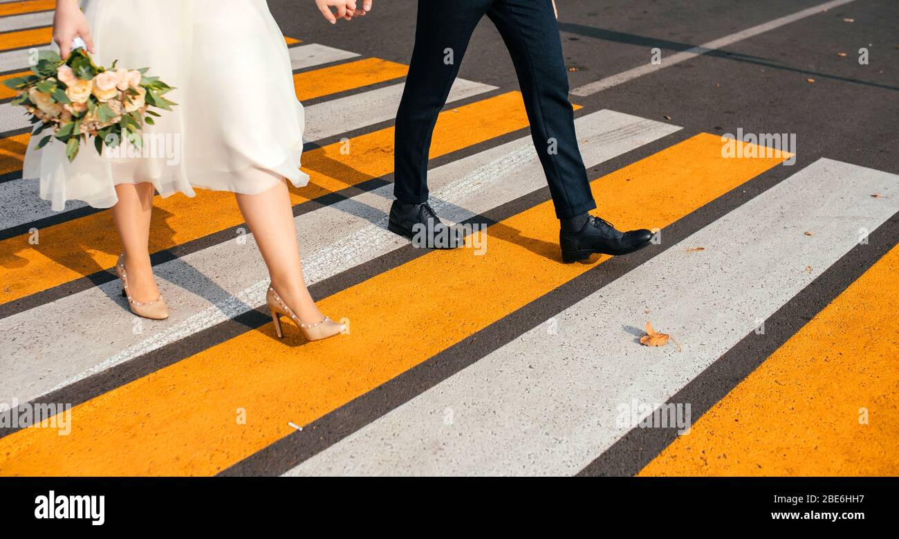 Family crossing crosswalk holding hands hi-res stock photography and ...