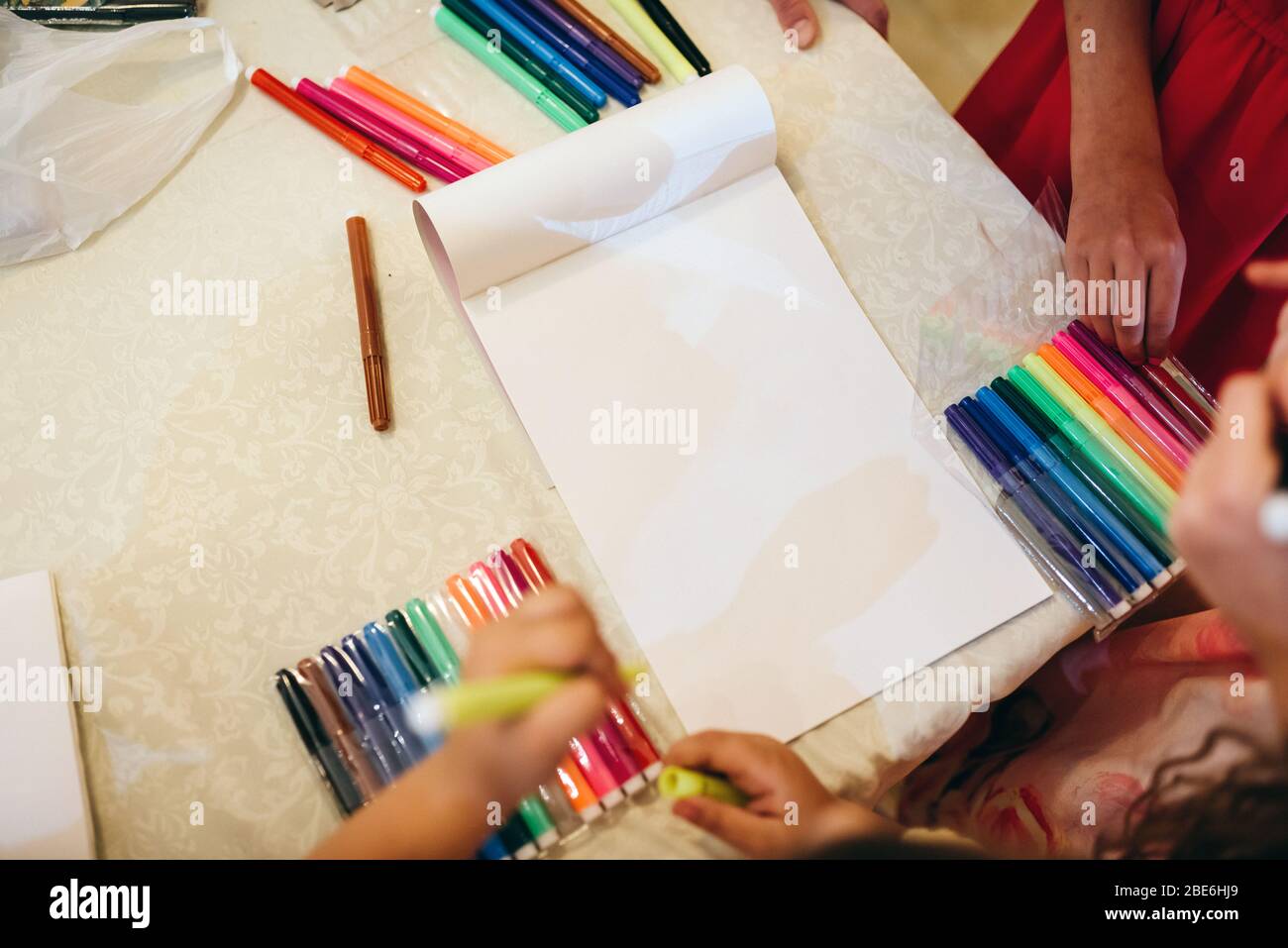Children drawing with markers and having fun at home Stock Photo - Alamy