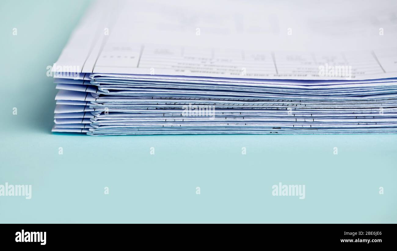 Stack Folding drawings on a blue background. Copy space Stock Photo - Alamy