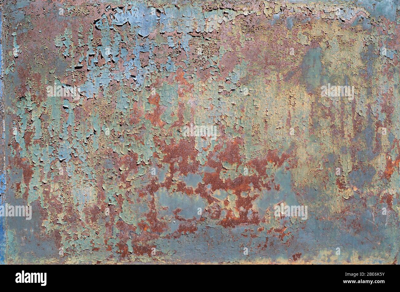 Close-up of a metal or steel plate, covered with old paint. Cracking ...