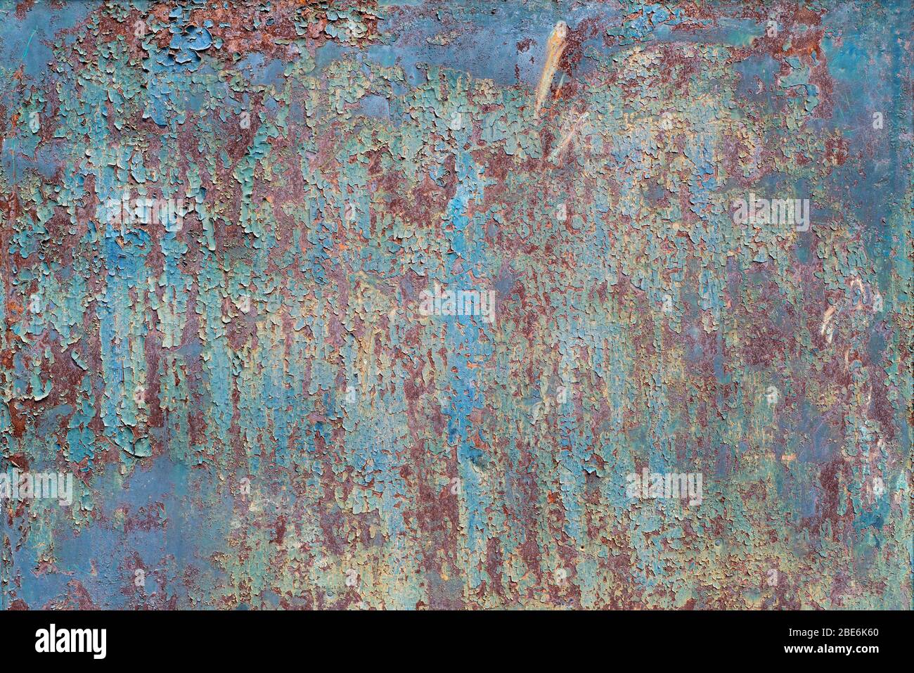 Close-up of a metal or steel plate, covered with old paint. Cracking ...