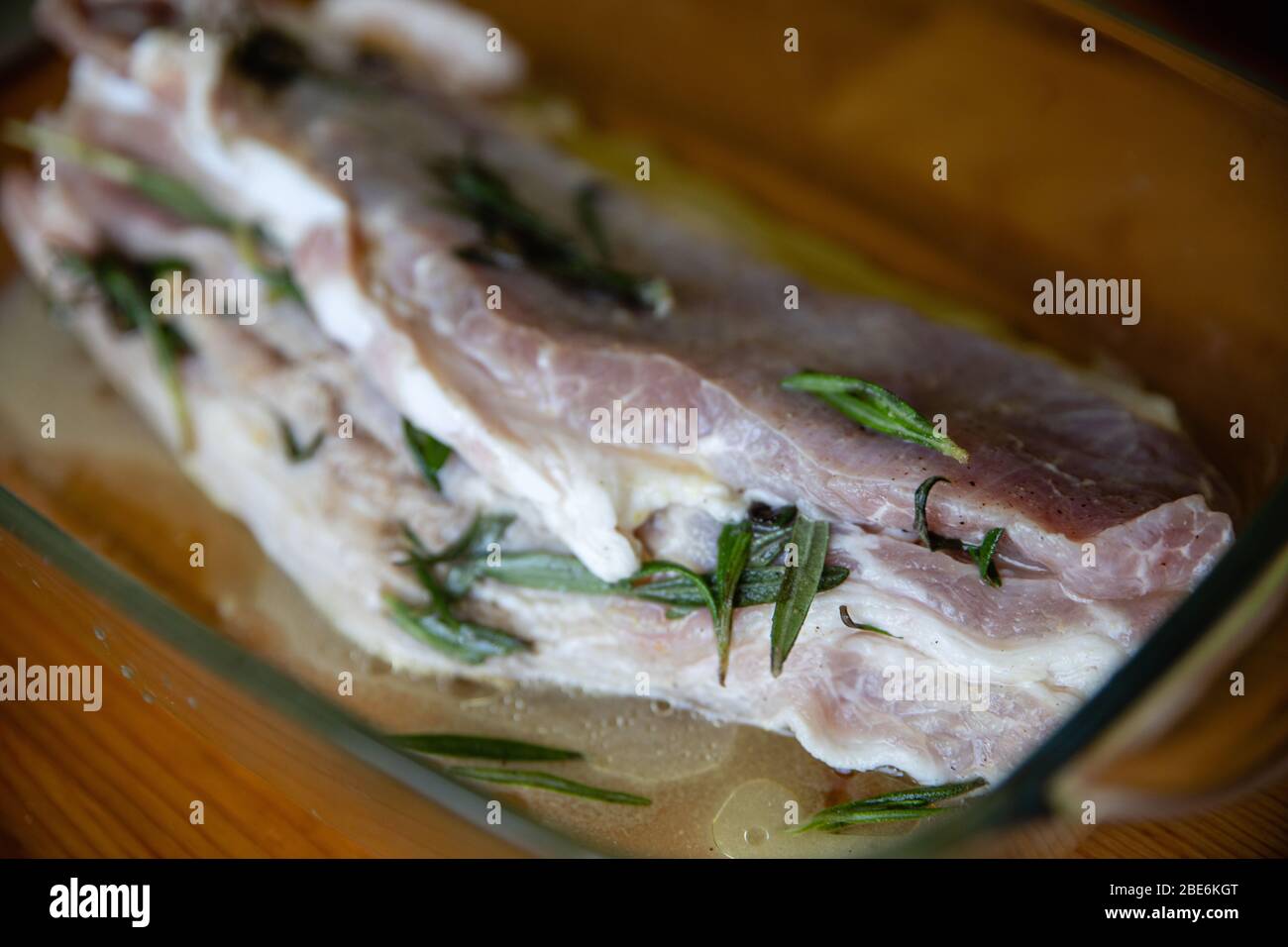 Raw fat pork meat seasoned with salt, papper, garlic and rosemary ...