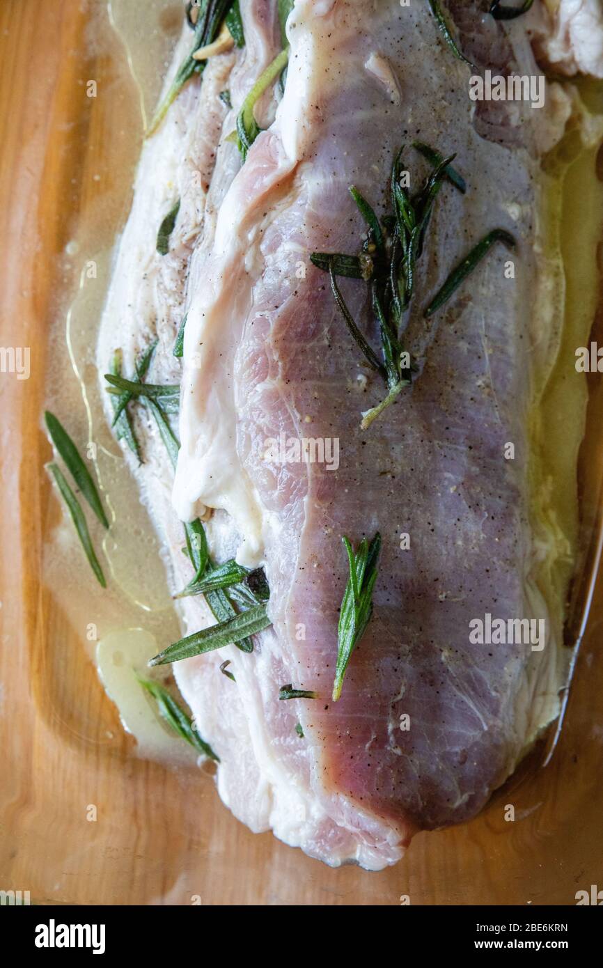 Raw fat pork meat seasoned with salt, papper, garlic and rosemary ...