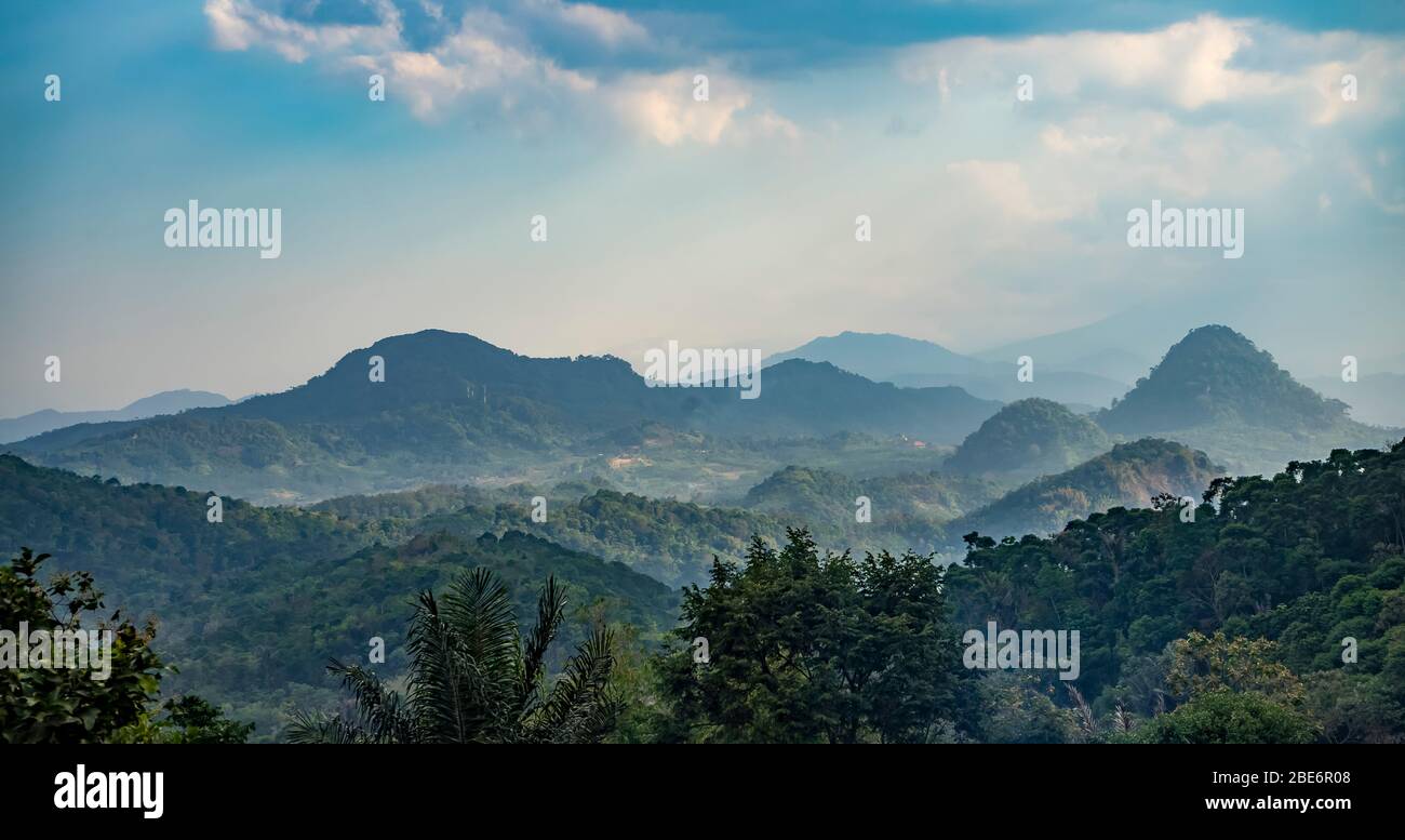 Javanese landscape with many hills in massive haze lush forest being ...