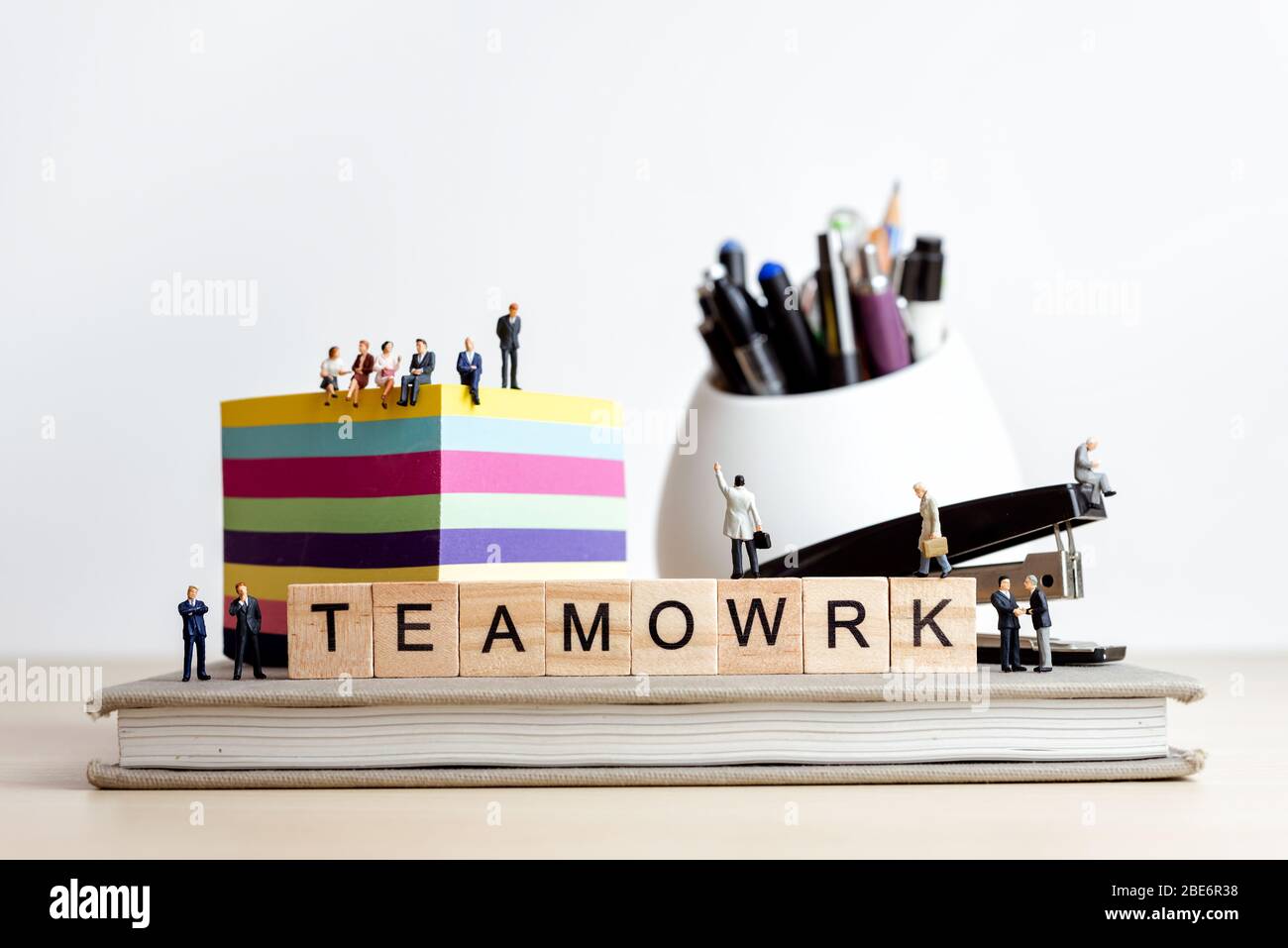 Group of miniature businesspeople in the office. Teamwork concept Stock ...