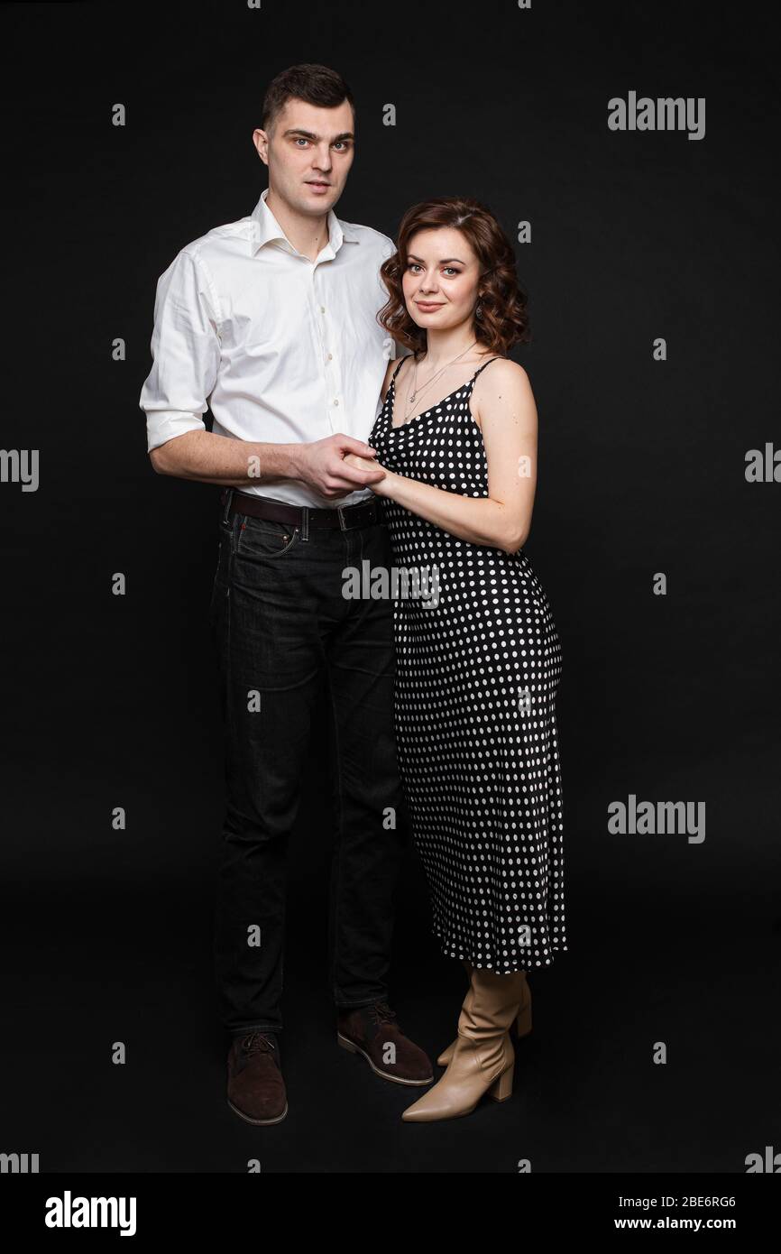 Happy couple in love stands and hugs together, picture isolated on ...