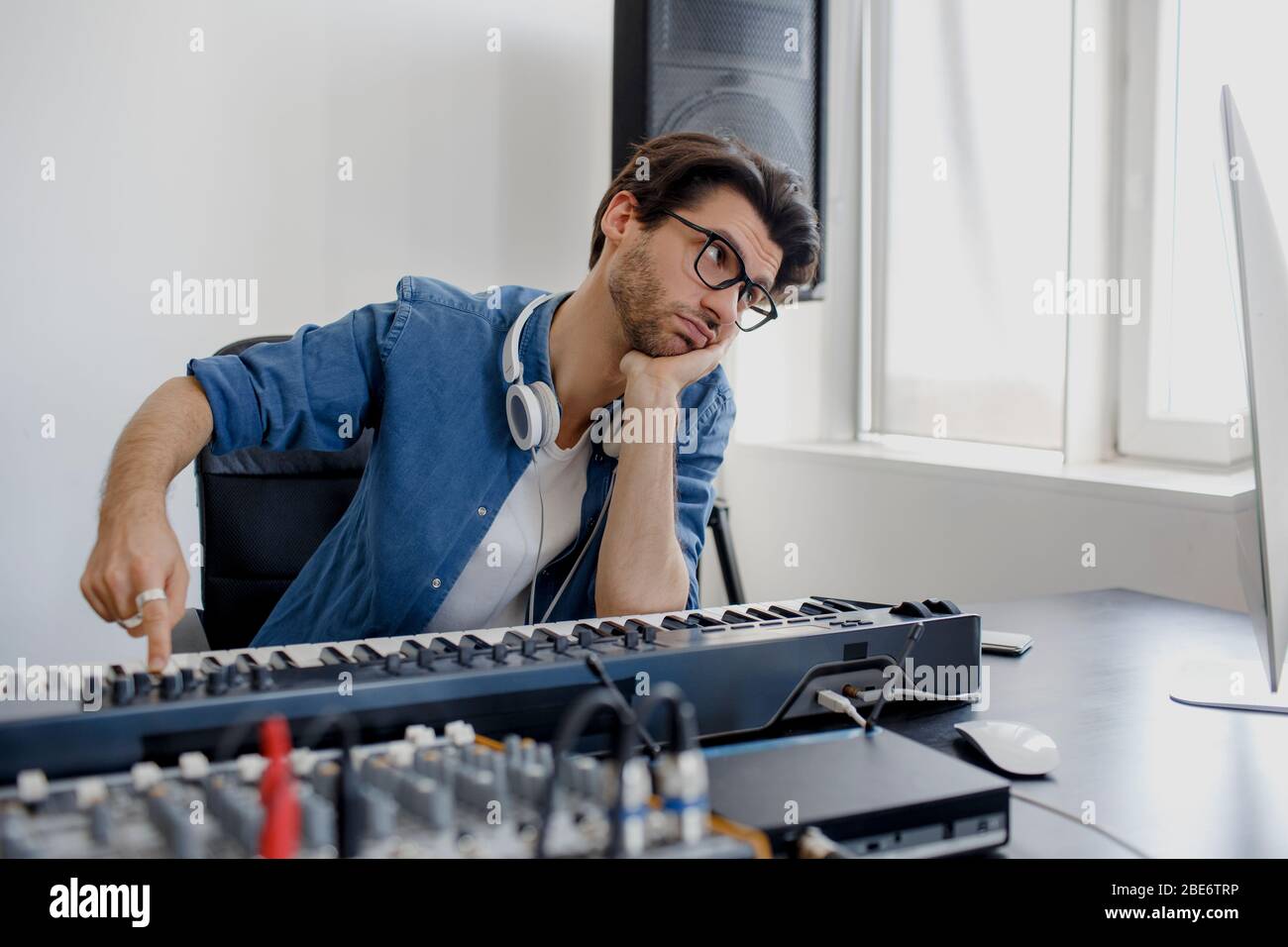 No mood and inspiration. Very boring. Male music arranger hands ...