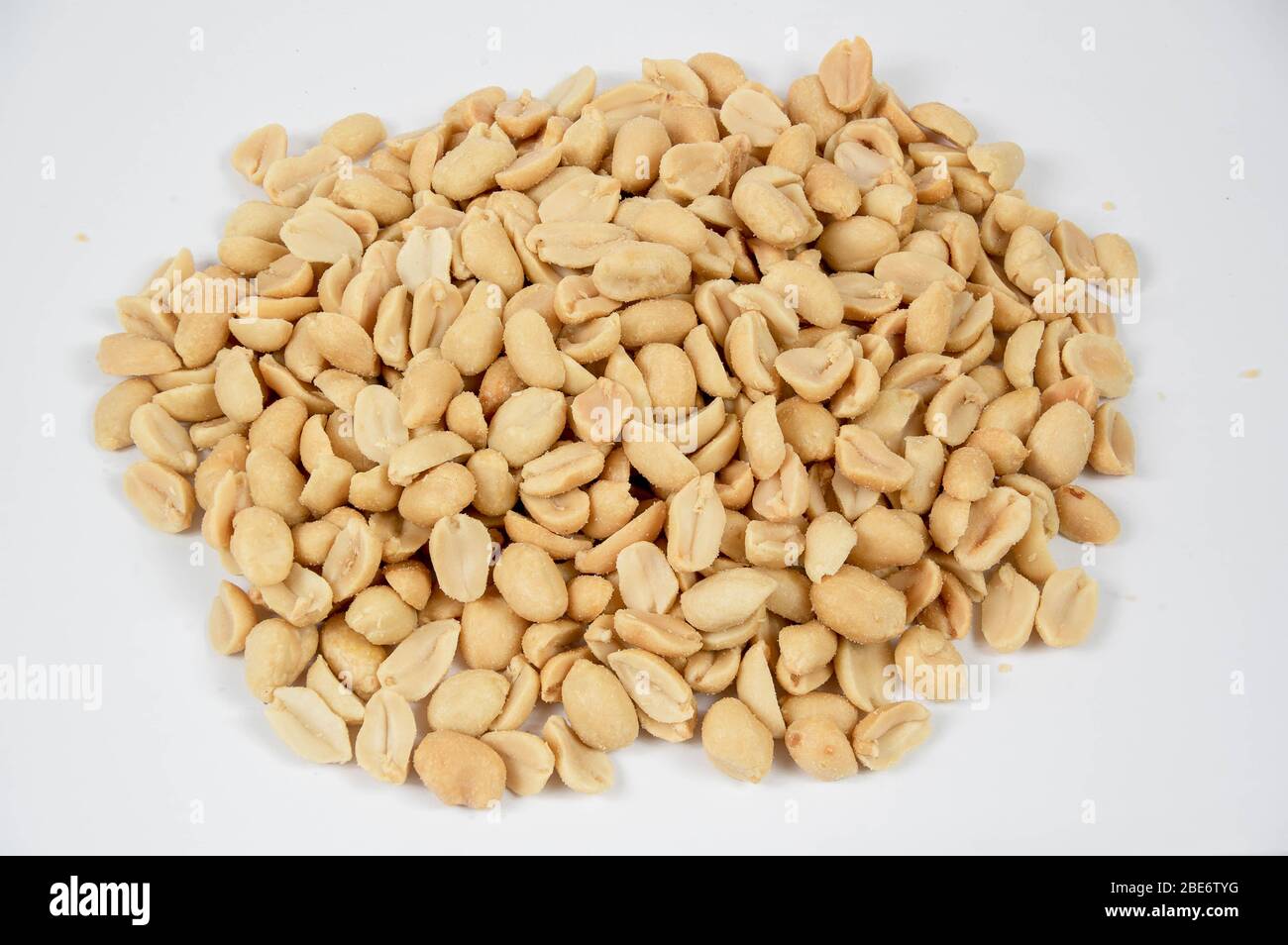 Salted and roasted peanuts on a white background Stock Photo - Alamy