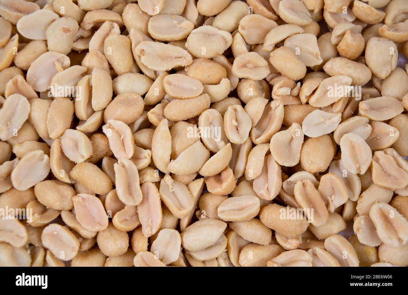 Salted and roasted peanuts background Stock Photo - Alamy