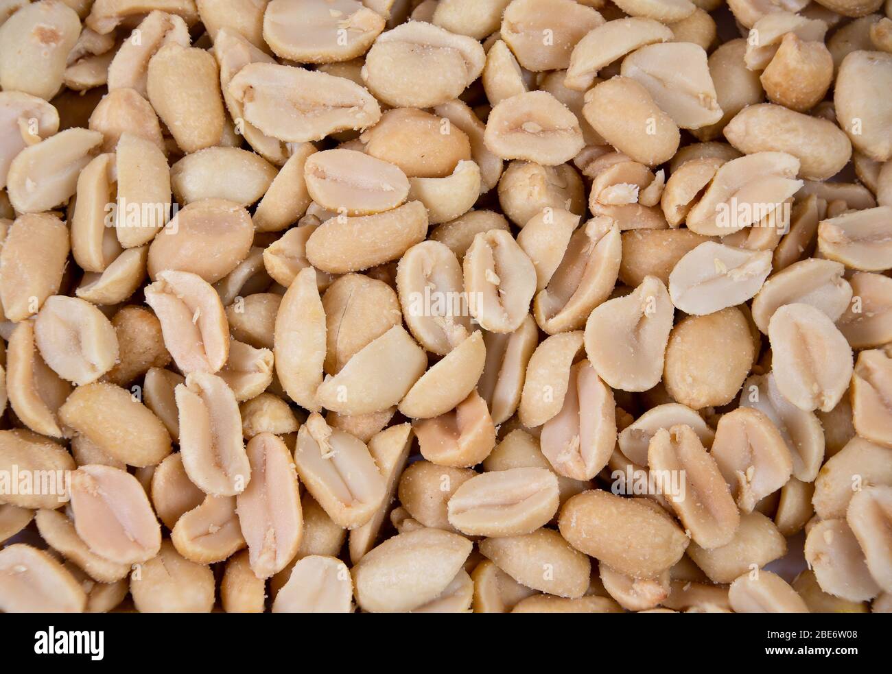 Salted and roasted peanuts background Stock Photo - Alamy