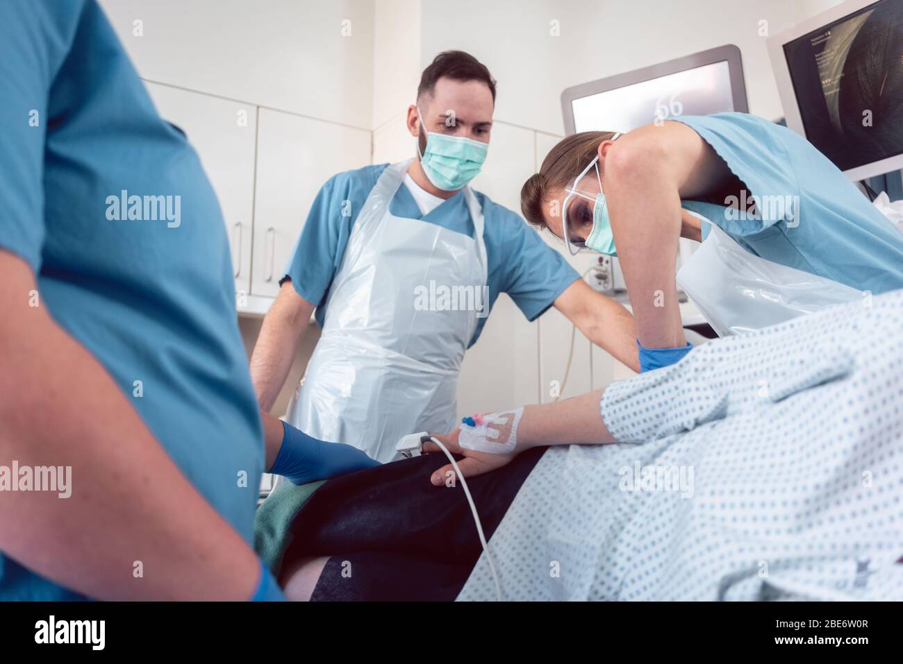 Proctologist in surgery of hospital performing colonoscopy Stock Photo ...