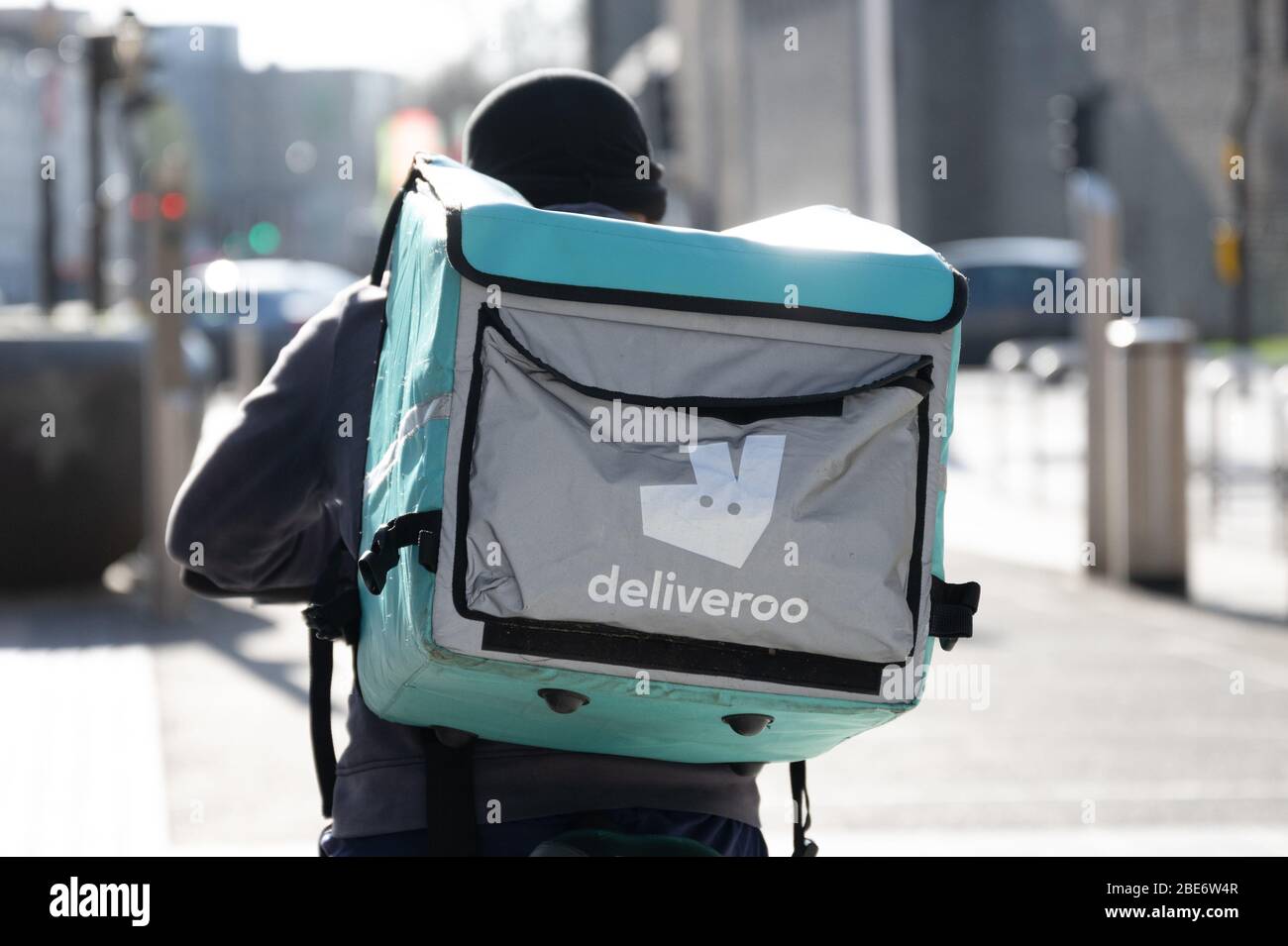A Deliveroo rider at work in Cardiff, Wales, UK Stock Photo - Alamy