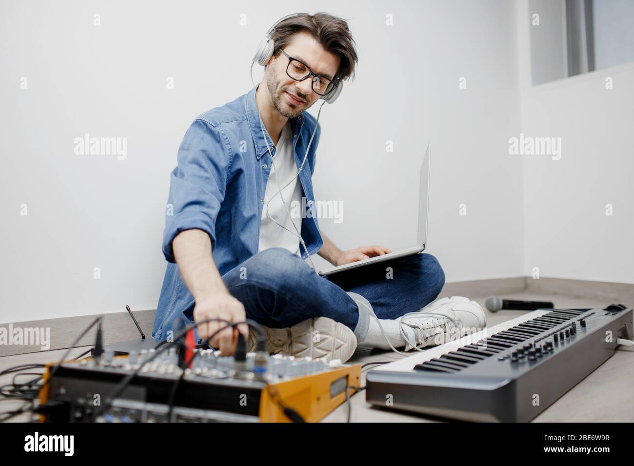 Man produce electronic soundtrack or track in project at home. Male ...