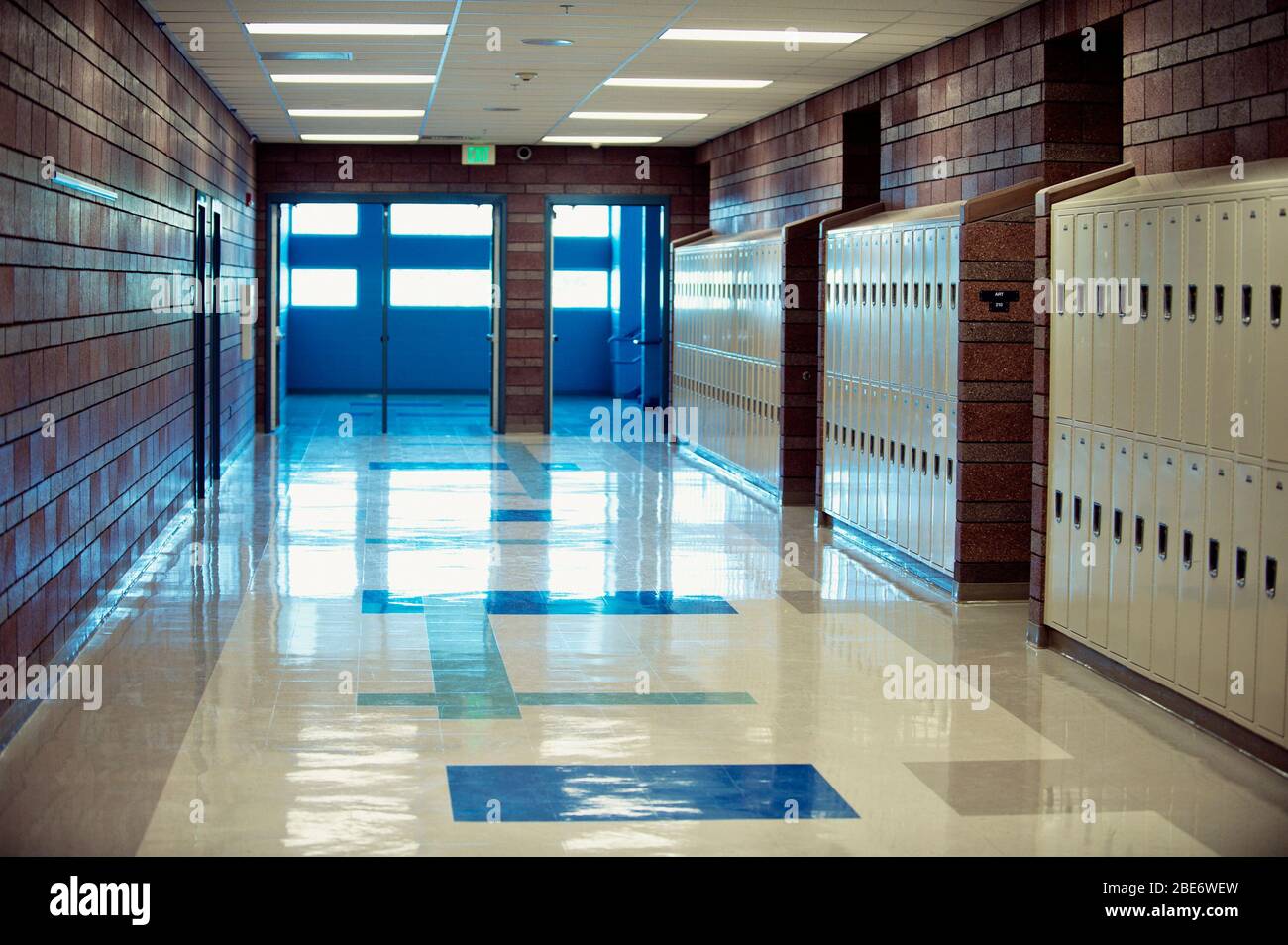 a high school hallway / that has nobody in it / but will soon enough ...