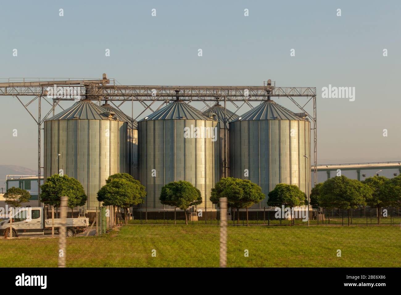 Raw material storage tanks,factory landscape gardening, and trees of a ...