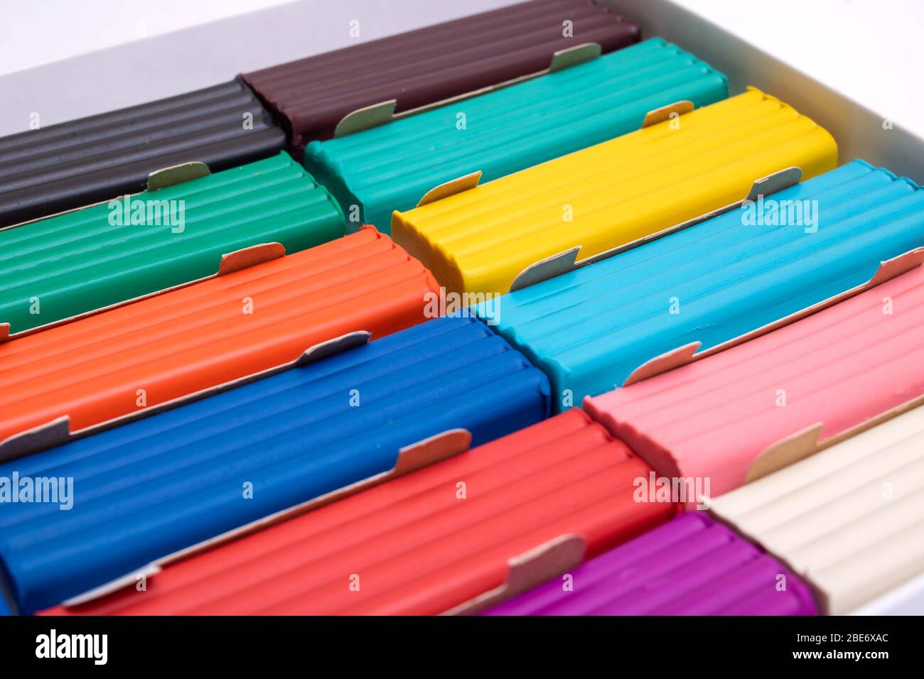 Multi-colored plasticine in a box close-up, background Stock Photo - Alamy