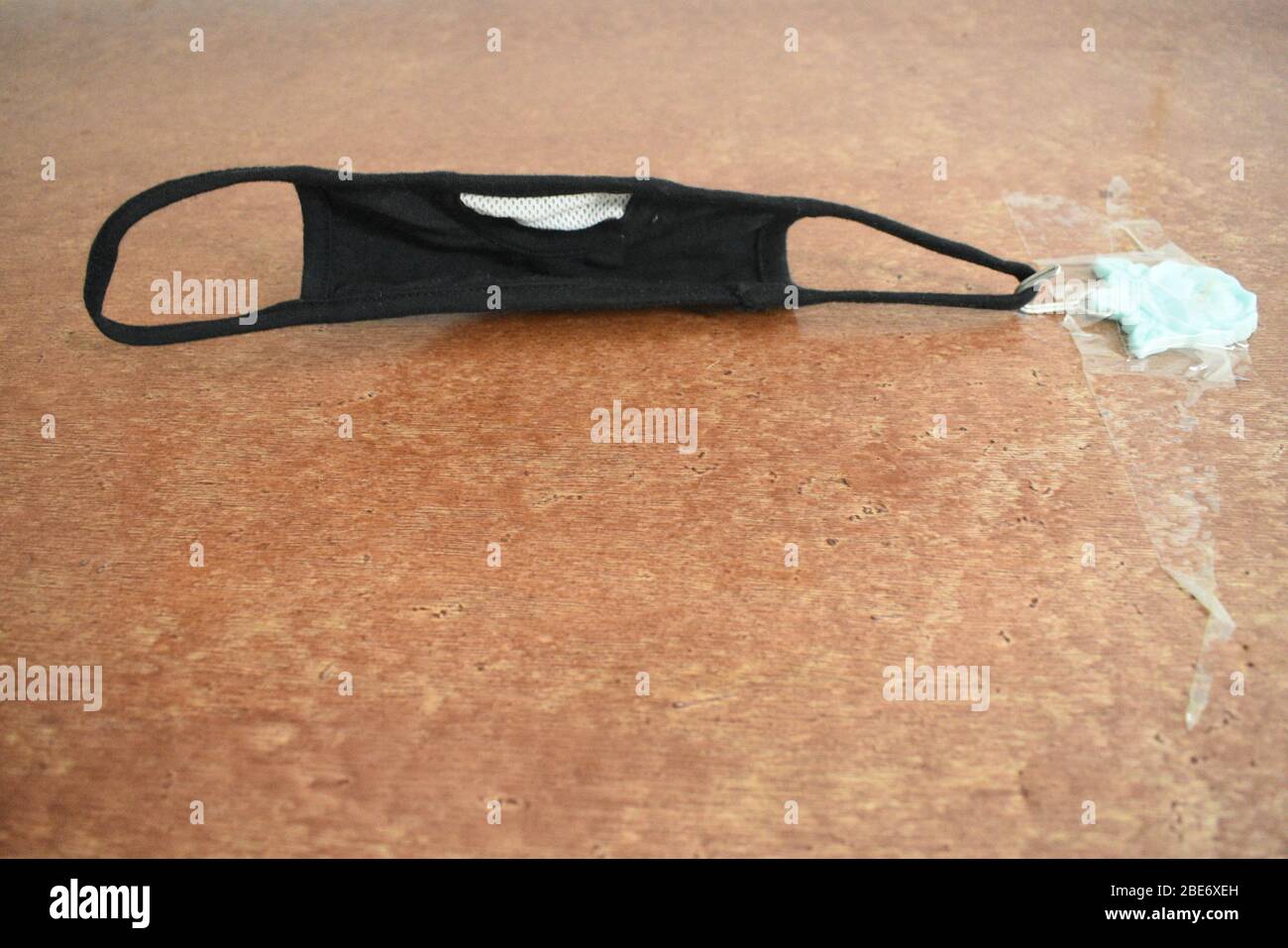 Black color face mask holding in the wall.Cover mouth and nose with ...