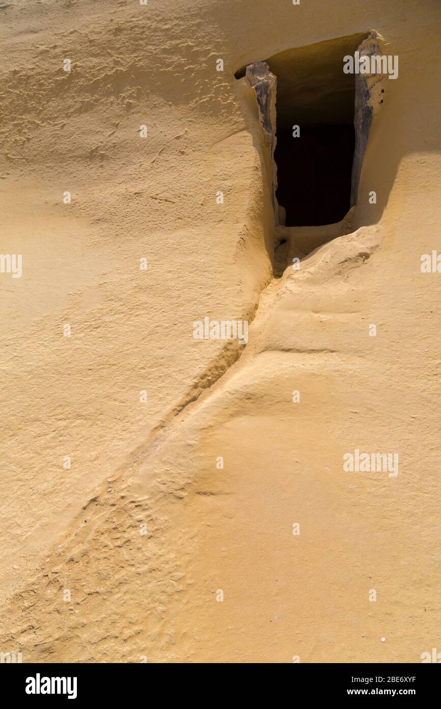 Door into rock cut room with eroded steps at the salt pans, Gozo Stock ...