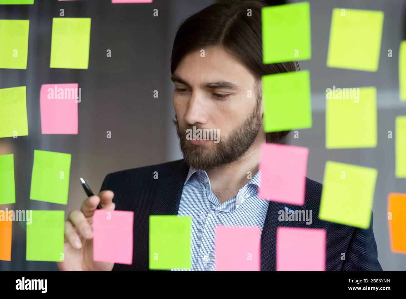 Pensive male employee do creative thinking developing startup Stock ...