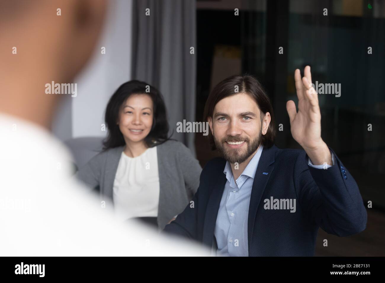 Raise hand office meeting hi-res stock photography and images - Alamy