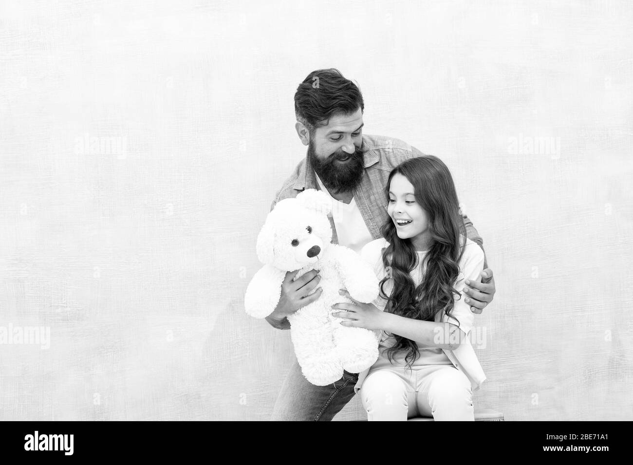 Giving soft toy teddy bear. Lovely father and kid. Father and daughter ...