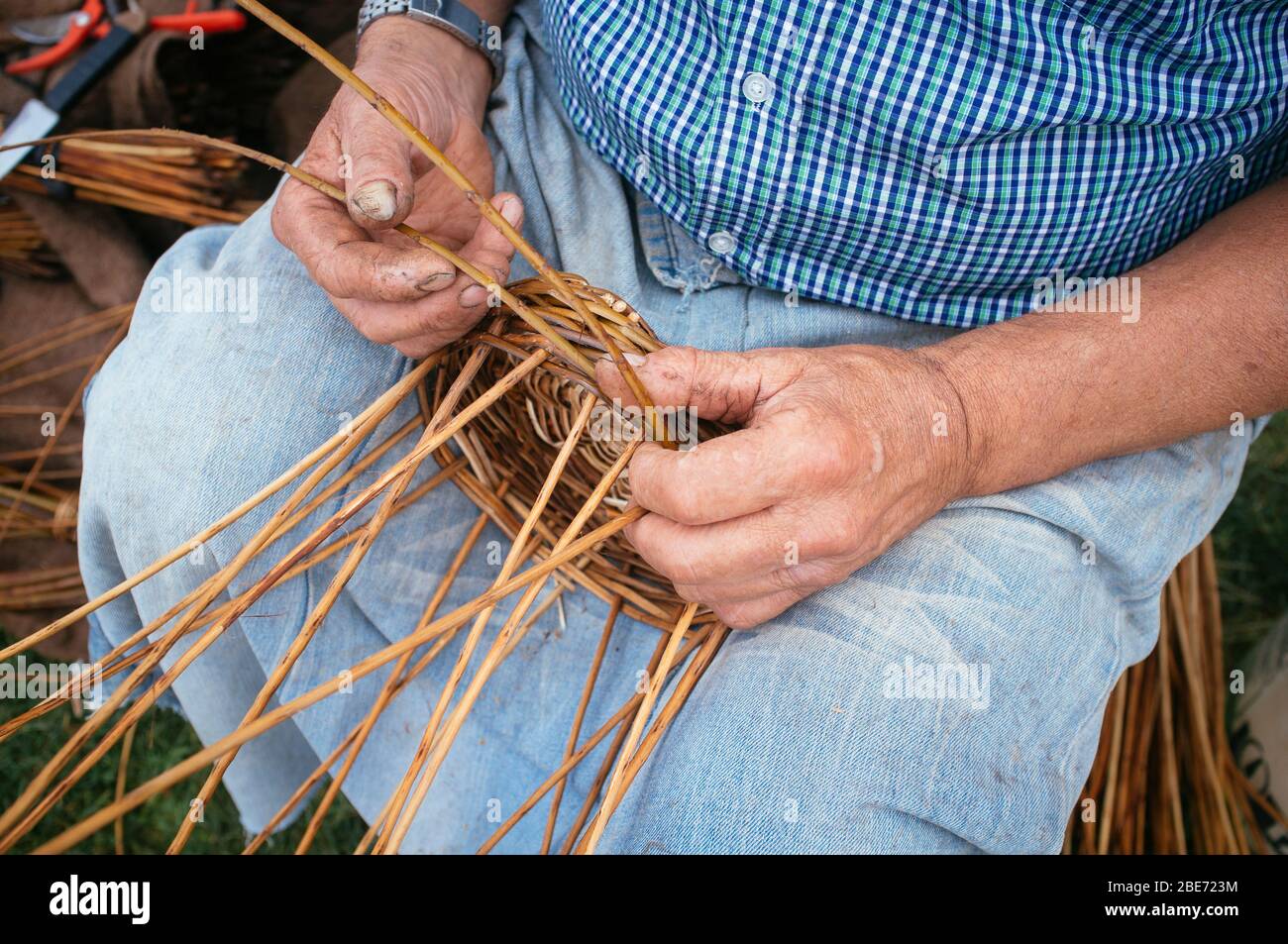 craftsman weaving a wicker basket Stock Photo - Alamy