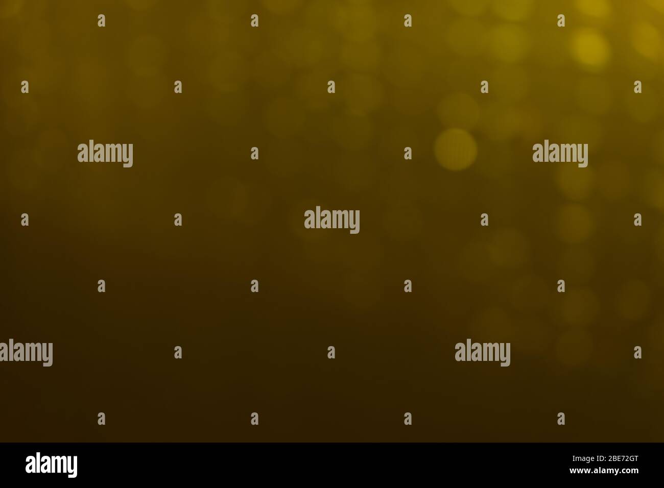 Glittering background with real bokeh of golden color Stock Photo - Alamy