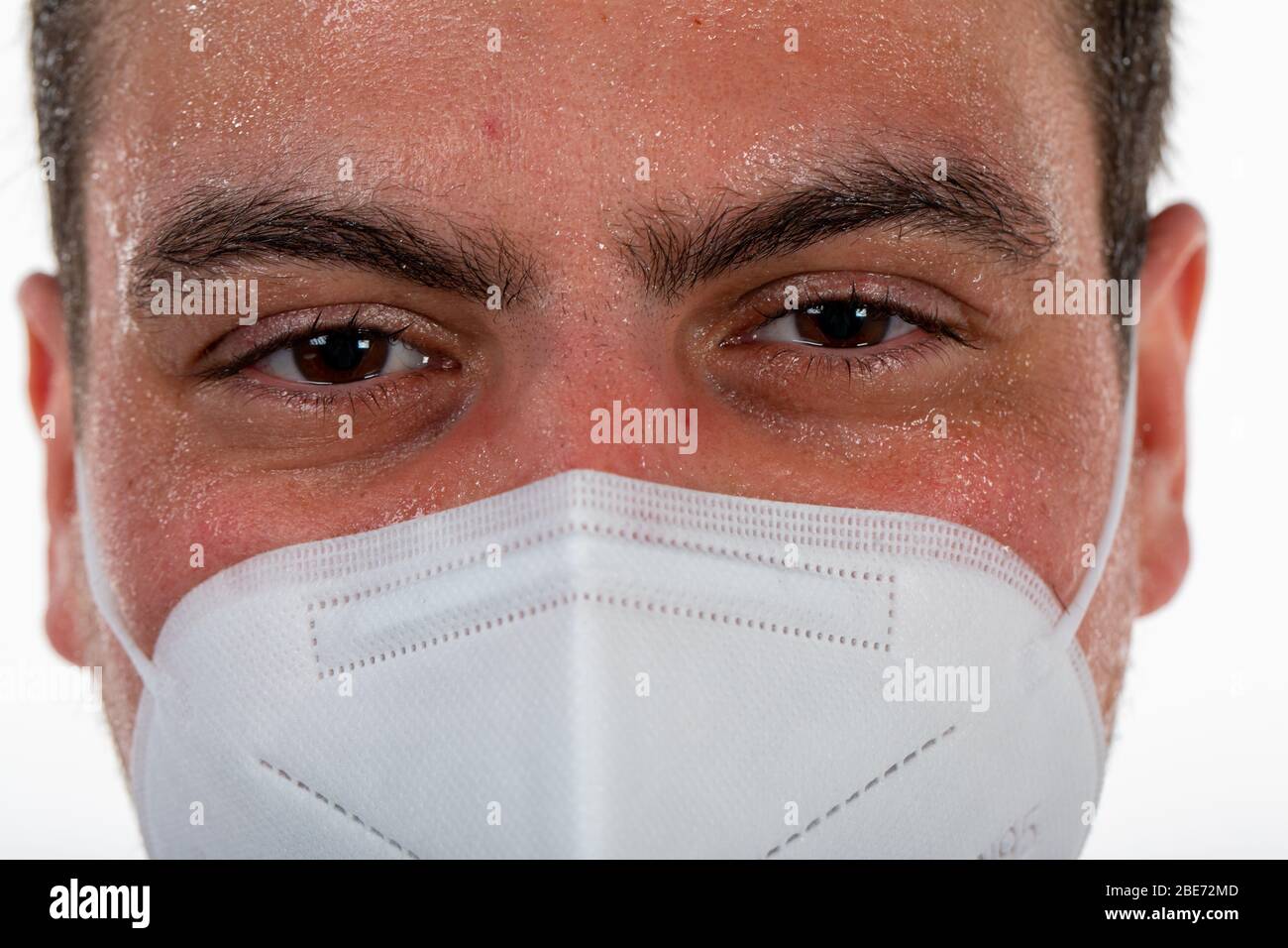 Corana patient with high fever wearing a face mask Stock Photo - Alamy
