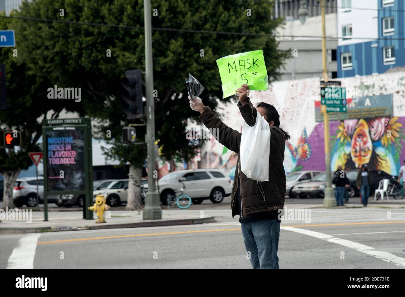 Los Angeles, CA/USA - April 9, 2020: A man on a street corner selling ...