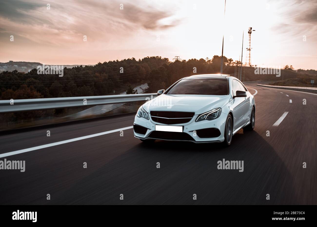 White business class car on the road , front view Stock Photo - Alamy