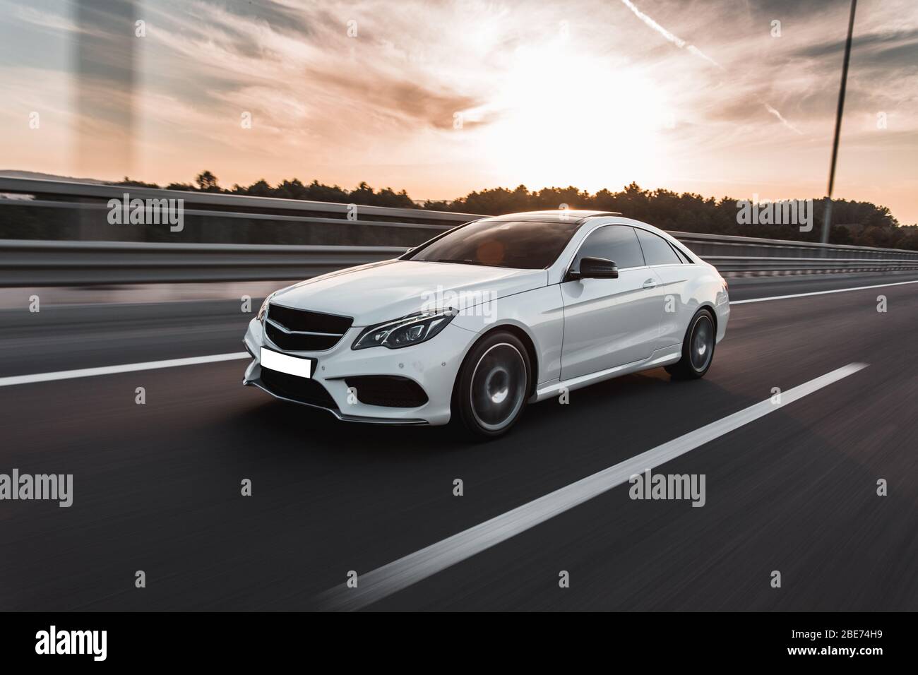 White business class car on the road Stock Photo - Alamy