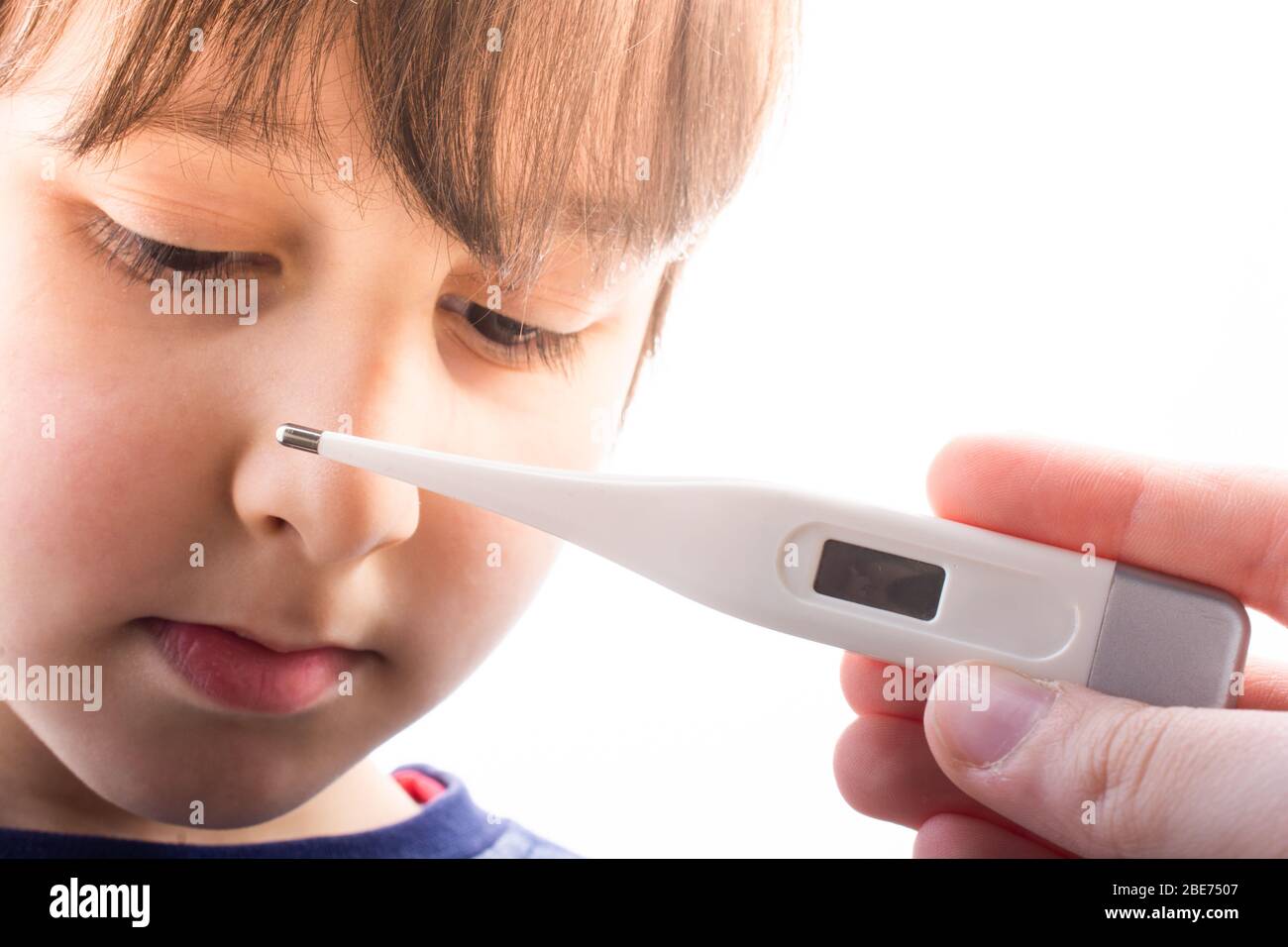 measuring Fever temperature. Child with thermometer. World pandemic ...