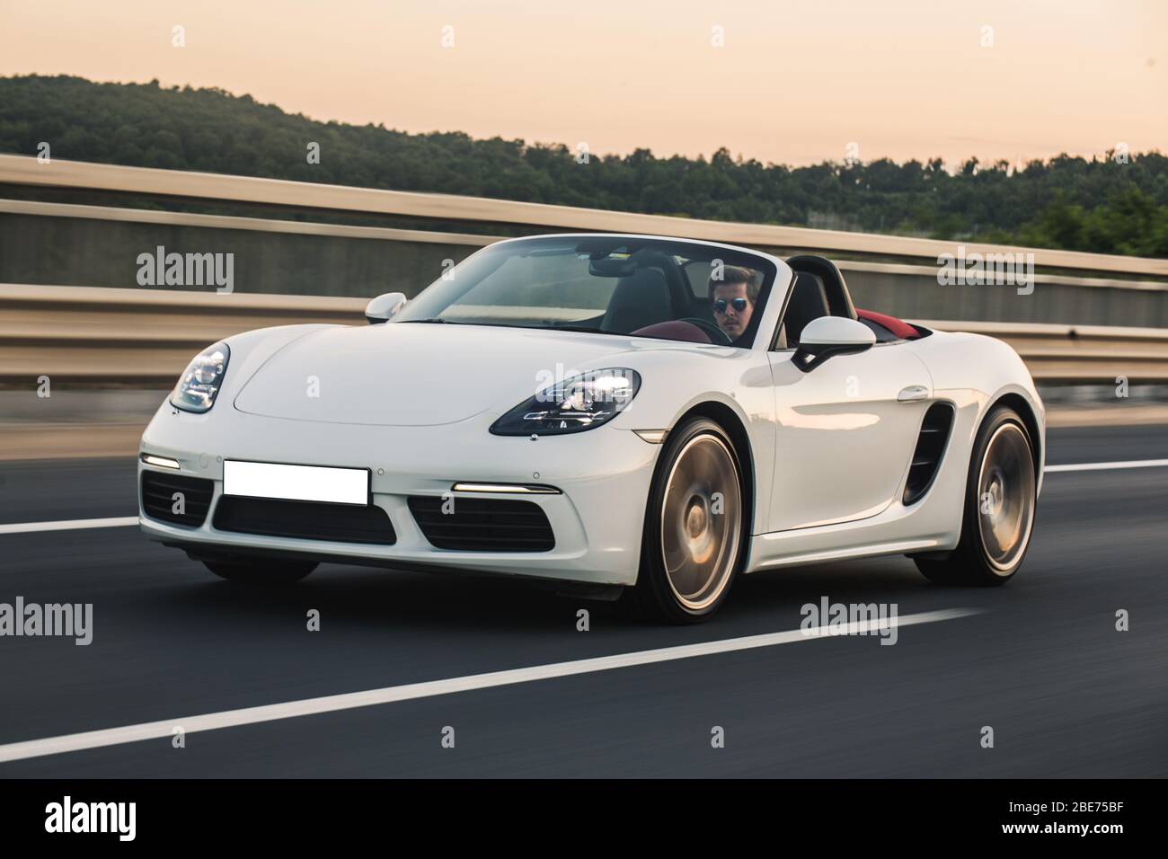 White super model cabriolet car driving on the highway,front view Stock ...