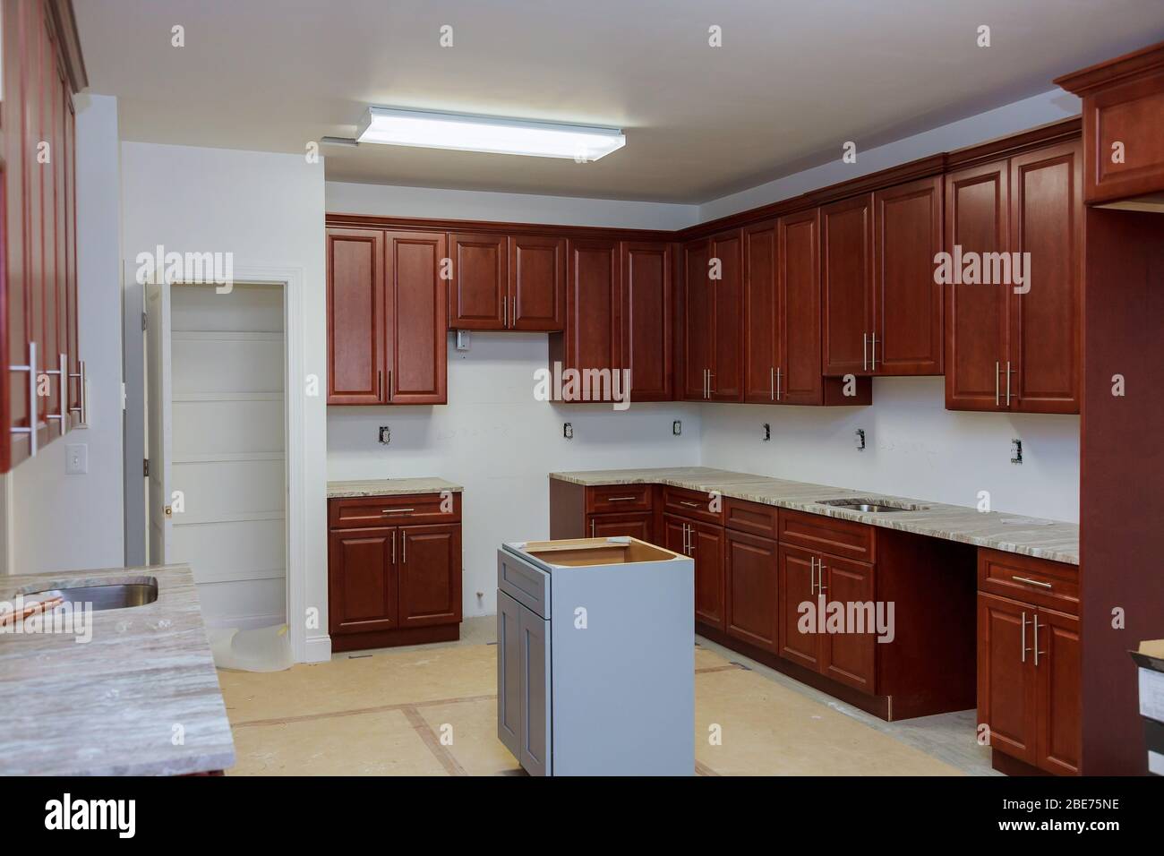 Wooden cabinets installation of in the modular kitchen of installation ...