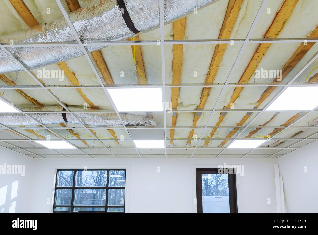 Office room frame hung ceiling at construction of metal rails of a ...