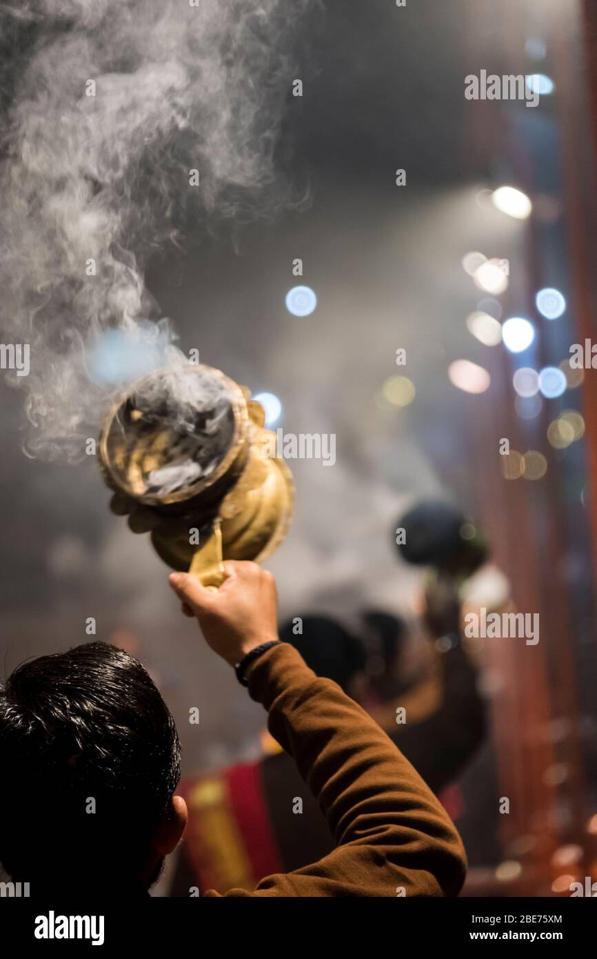Smoke and incense during Aarti in Varanasi ghat by the Ganga river ...