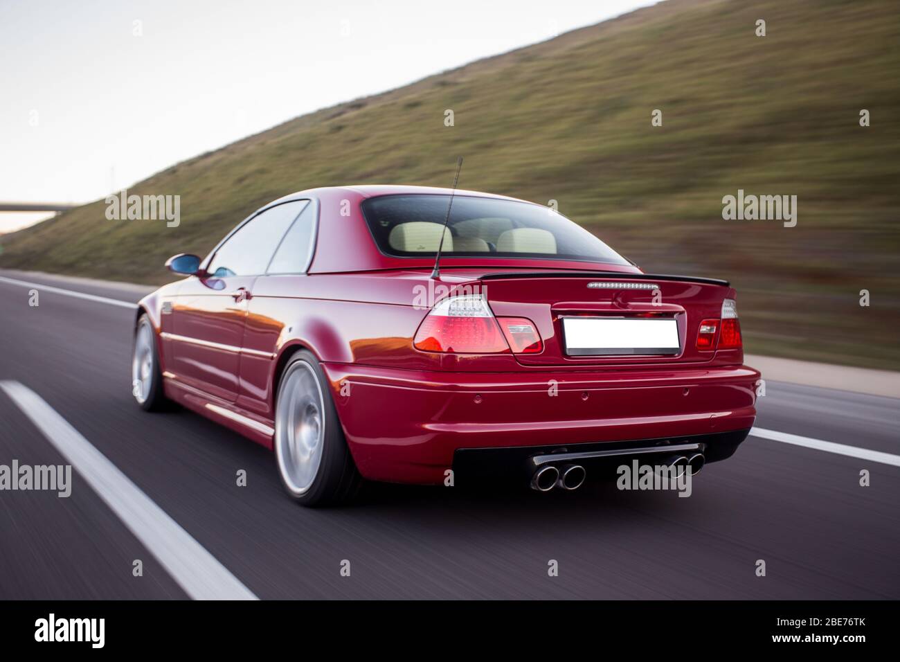 Red vintage model sedan car, view from behind Stock Photo - Alamy