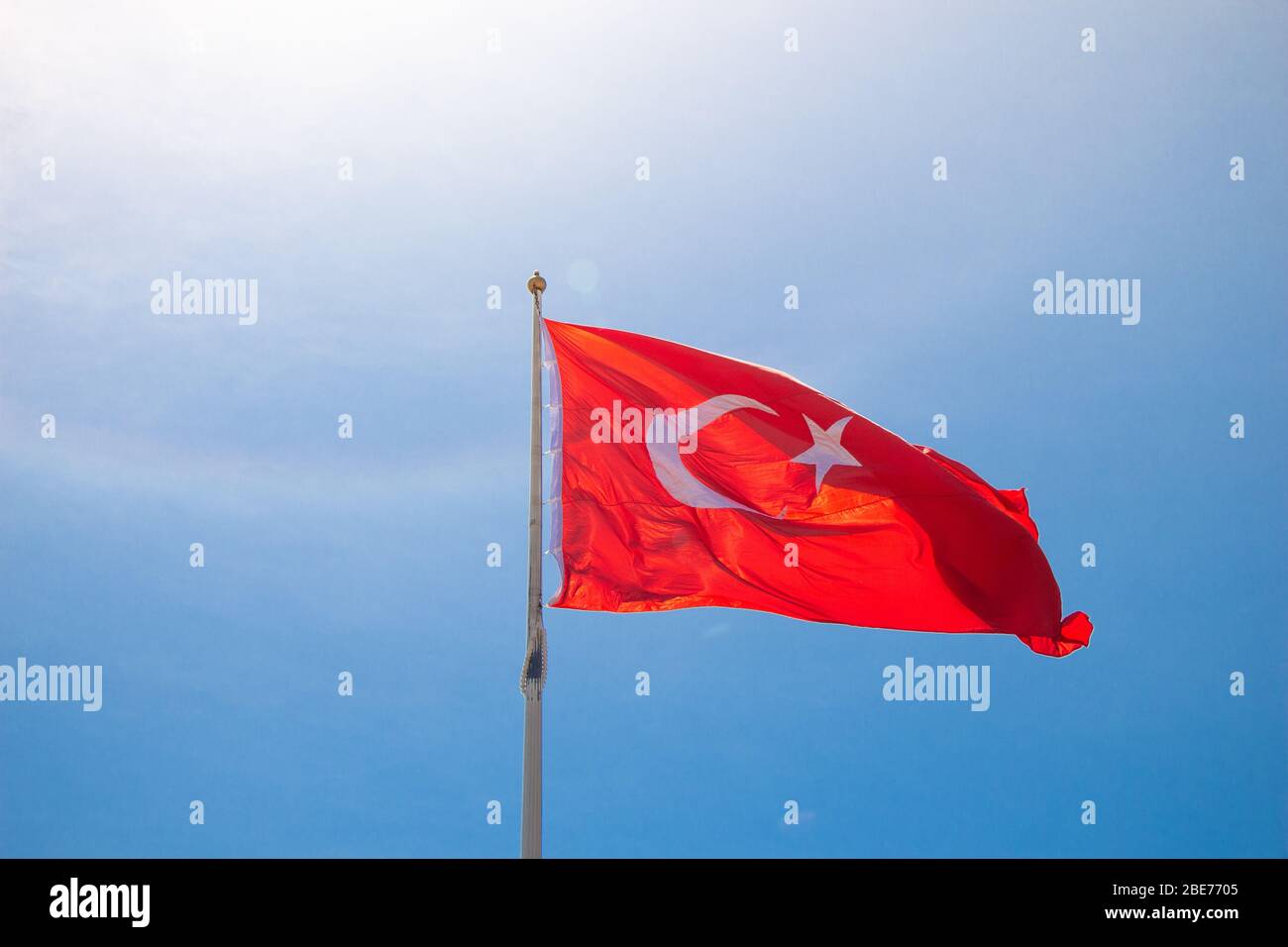 Turkish national flag with white star and moon on a pole in sky Stock ...