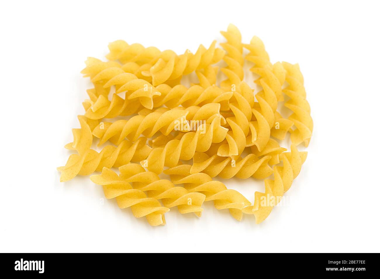Homemade fusilli pasta heap on white isolated background in macro top ...
