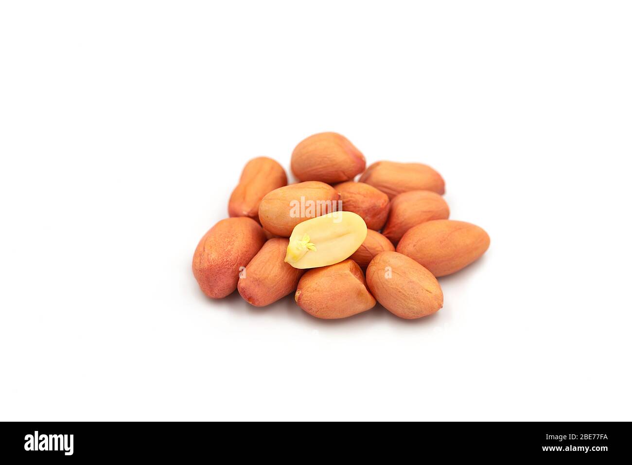 Heap raw organic peanut with peel on white background and copy space ...